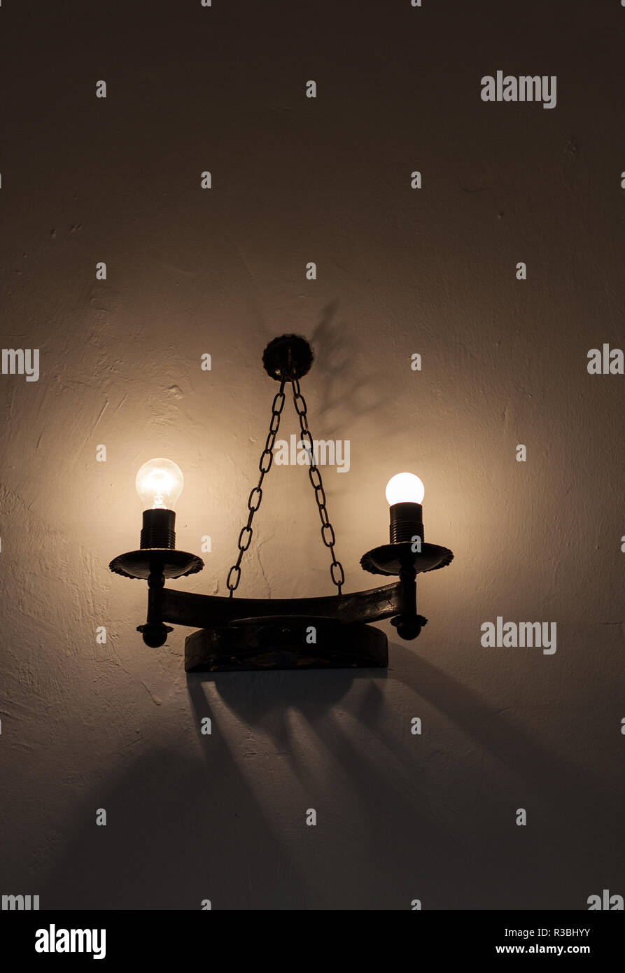 Old lamp hanging on a castle wall Stock Photo - Alamy