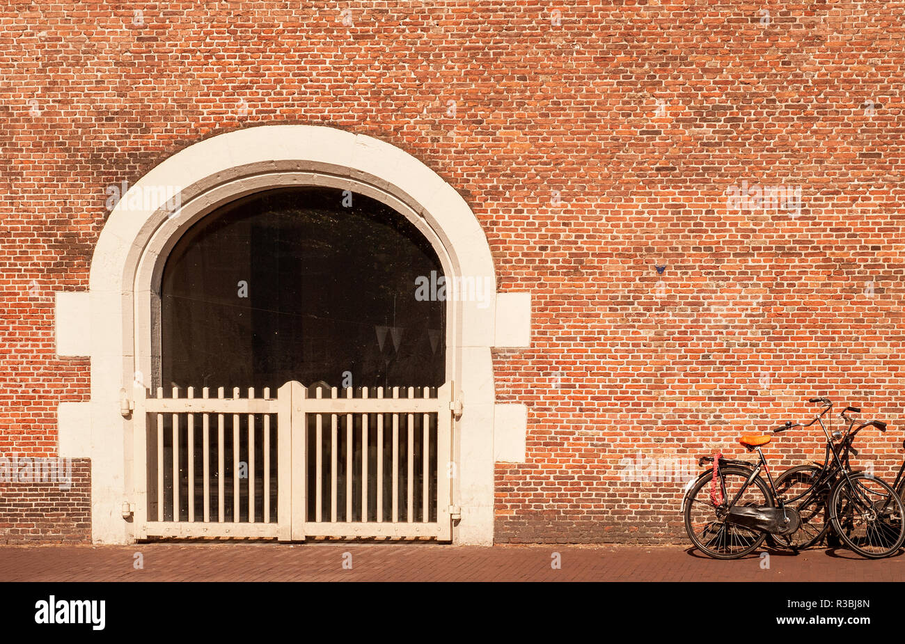 Traditional dutch brick wall and bicycles in Amsterdam Stock Photo - Alamy