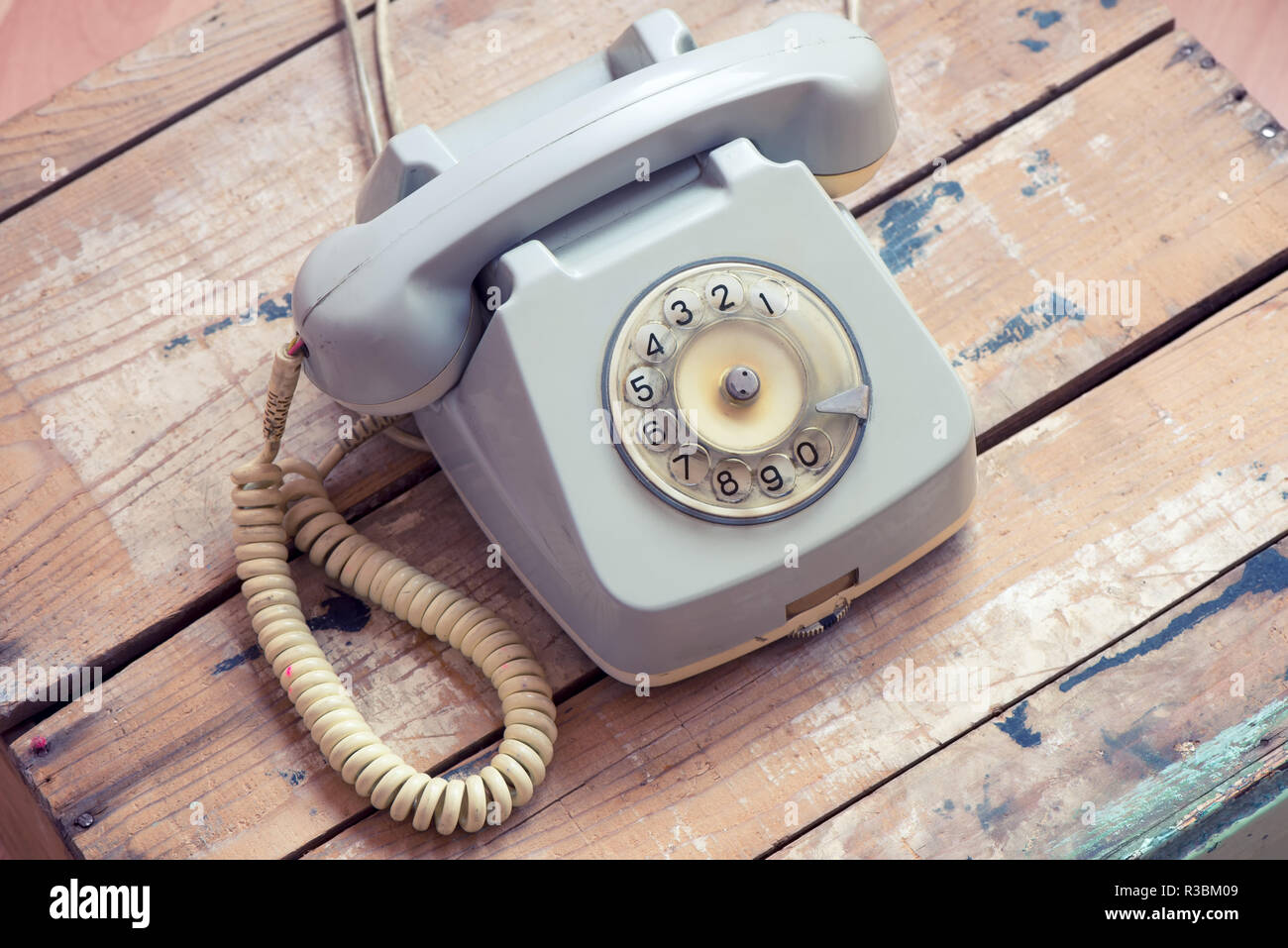 Old telephone with rotary dial on wooden background Stock Photo - Alamy