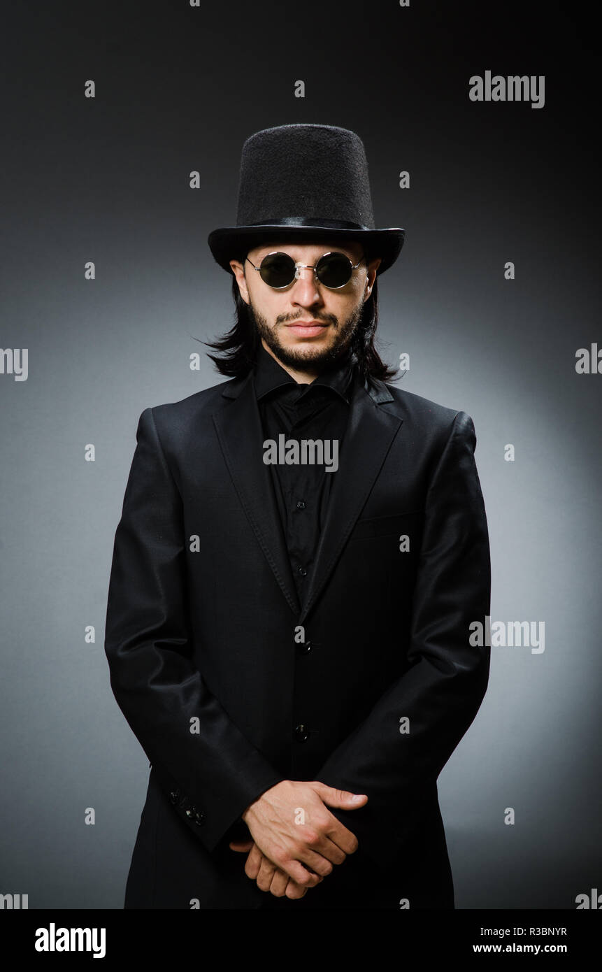Vintage concept with man wearing black top hat Stock Photo - Alamy