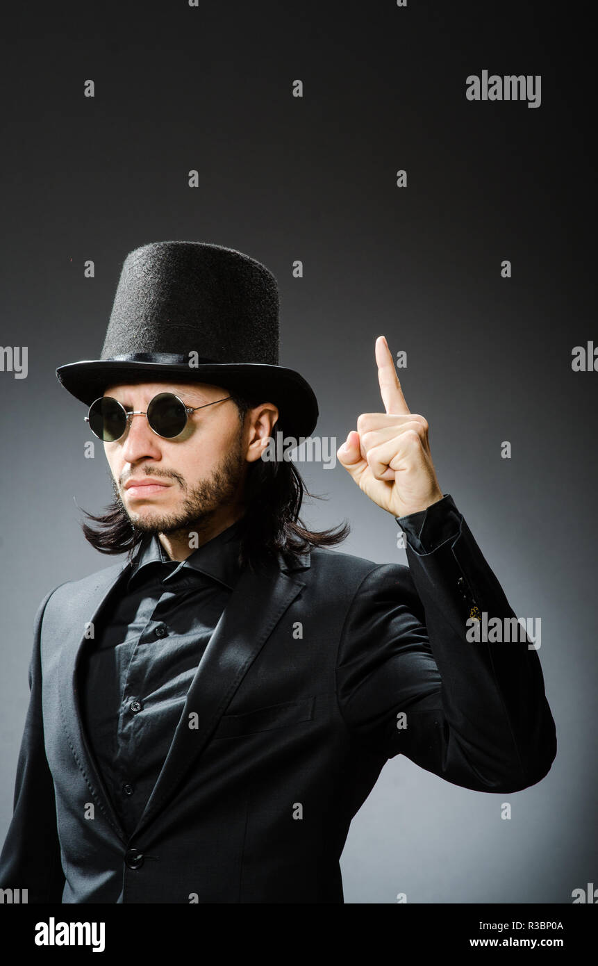 Vintage concept with man wearing black top hat Stock Photo - Alamy