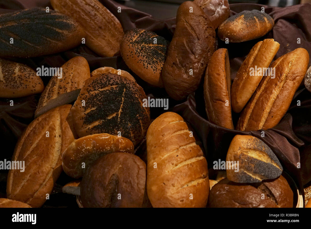 many rolls of different breads in the bakery restaurant Stock Photo - Alamy