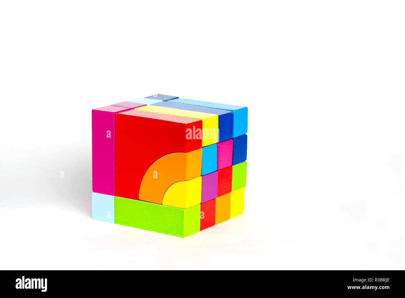 Colored wooden blocks, cubes, build on a light white background.A cube ...