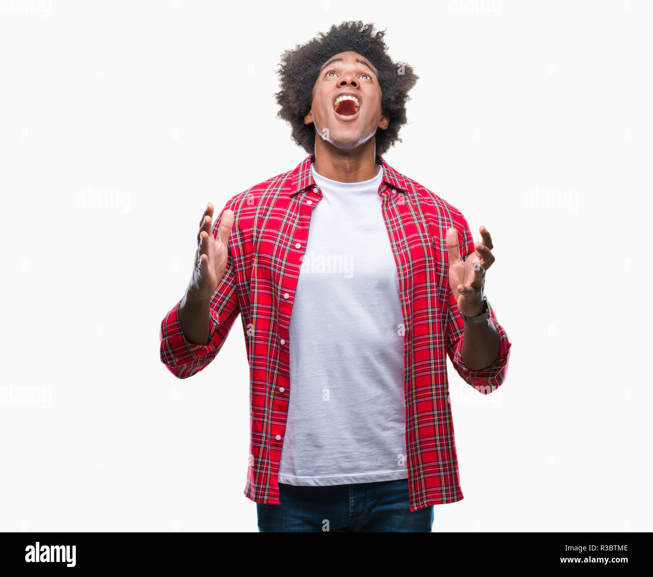 Afro american man over isolated background crazy and mad shouting and ...