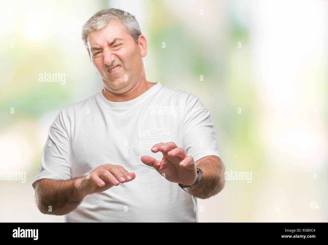 Handsome senior man over isolated background disgusted expression ...
