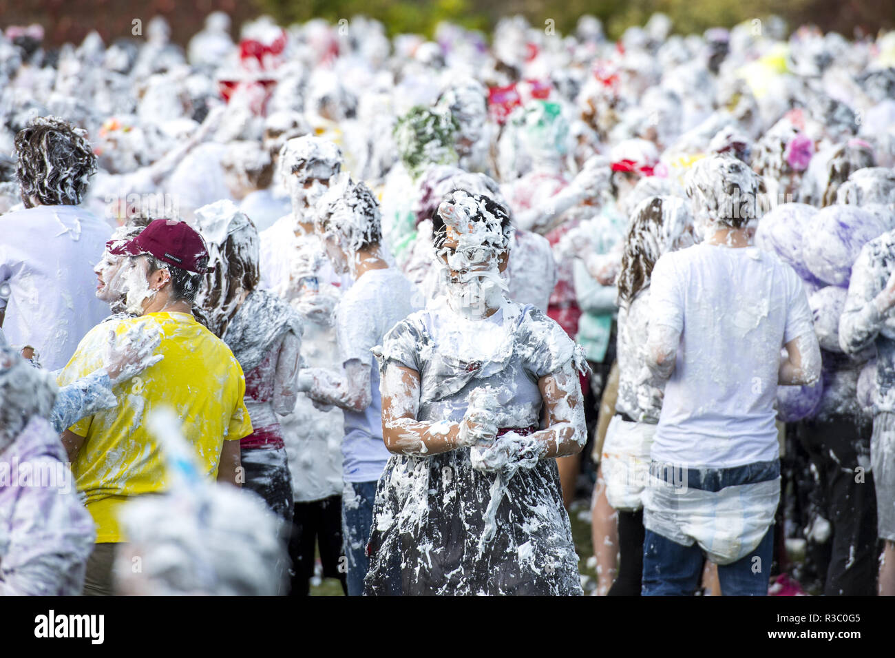 A couple give each other a foamy kiss as the University of St Andrews's ...