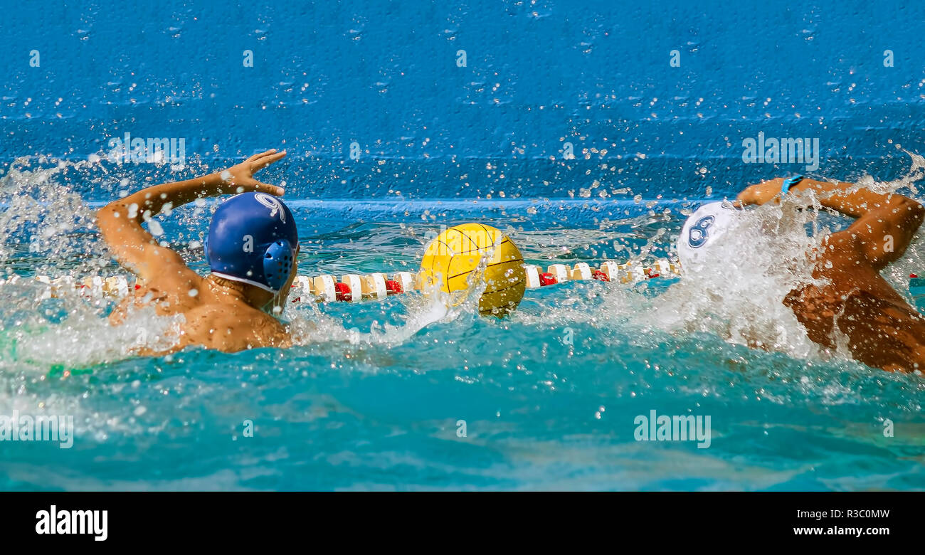 duel water polo players match pool Stock Photo - Alamy