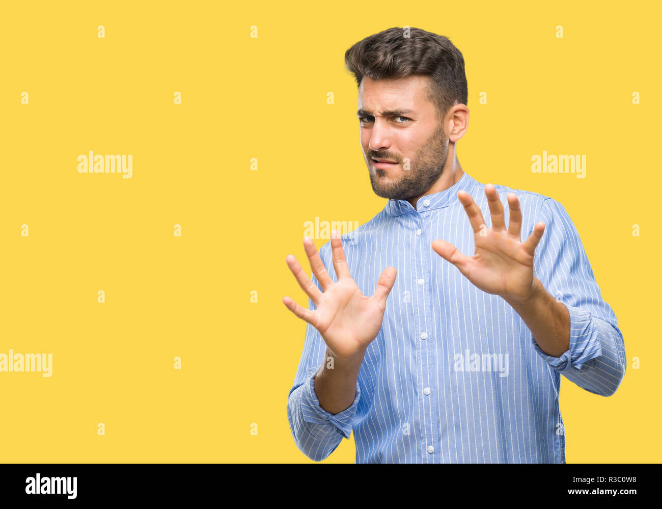 Young handsome man over isolated background disgusted expression ...