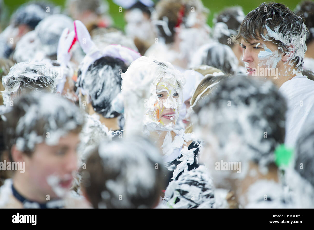 A couple give each other a foamy kiss as the University of St Andrews's ...