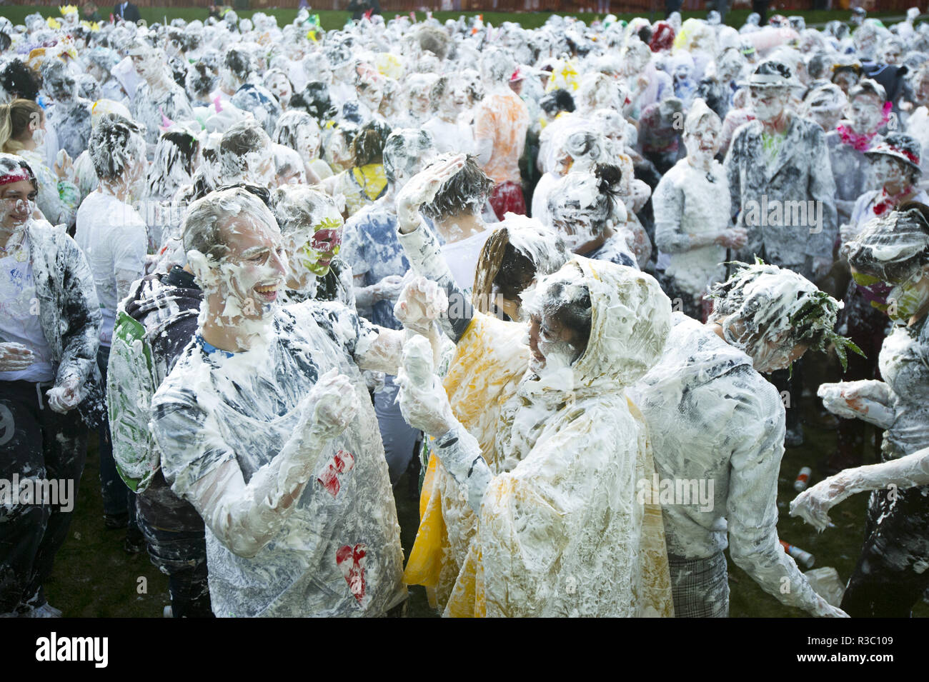 A couple give each other a foamy kiss as the University of St Andrews's ...