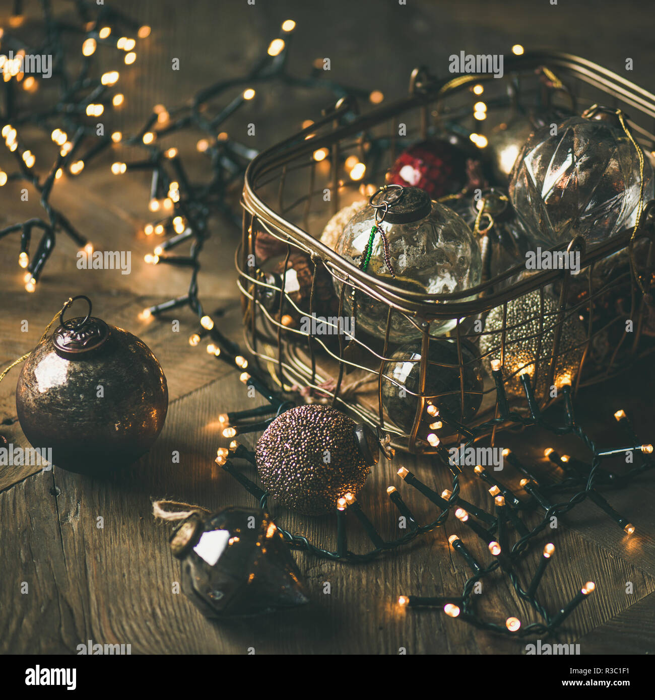 Christmas tree decoration balls in box and garland, square crop Stock ...