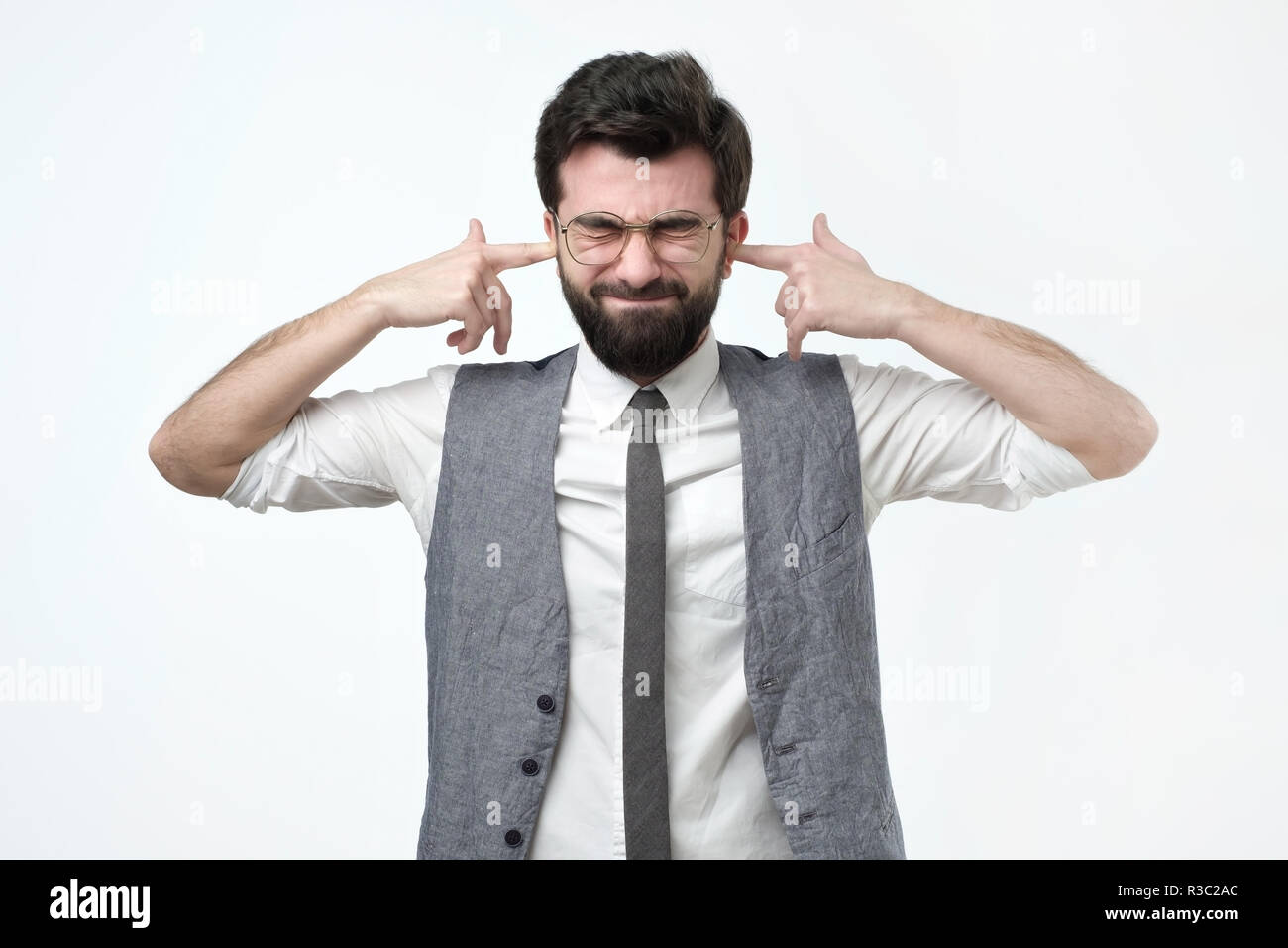 Too loud music fingers ears hearing loud hi-res stock photography and ...