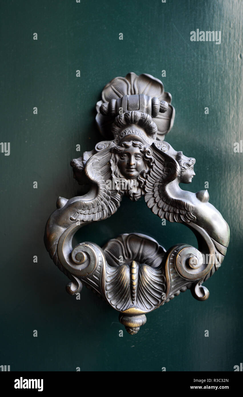 A traditional door Italian door handle Stock Photo - Alamy