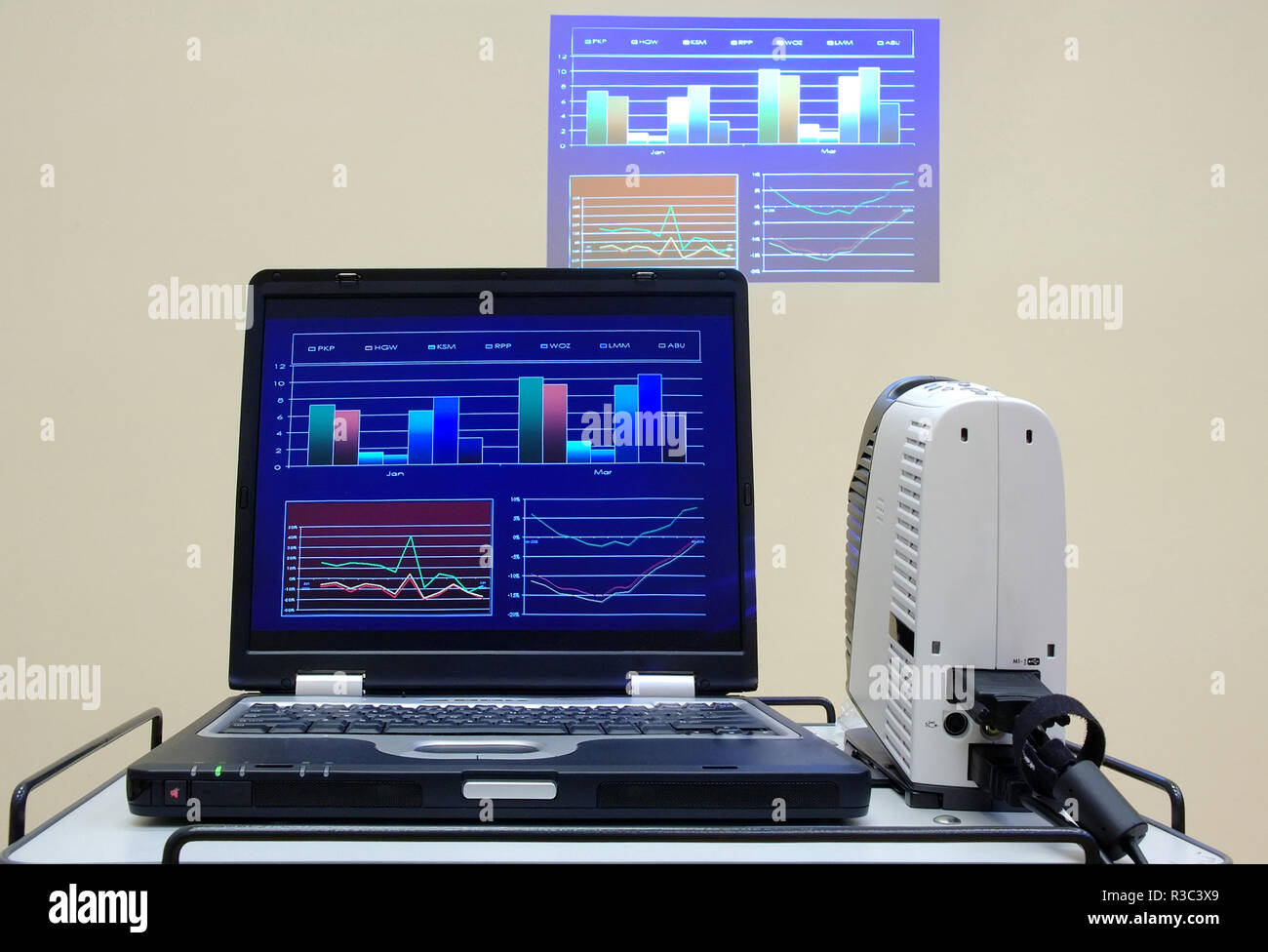 Laptop with the projector during the presentation Stock Photo - Alamy