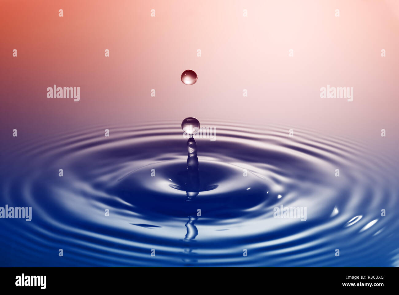 Colorful water splash. Falling drop of water Stock Photo - Alamy