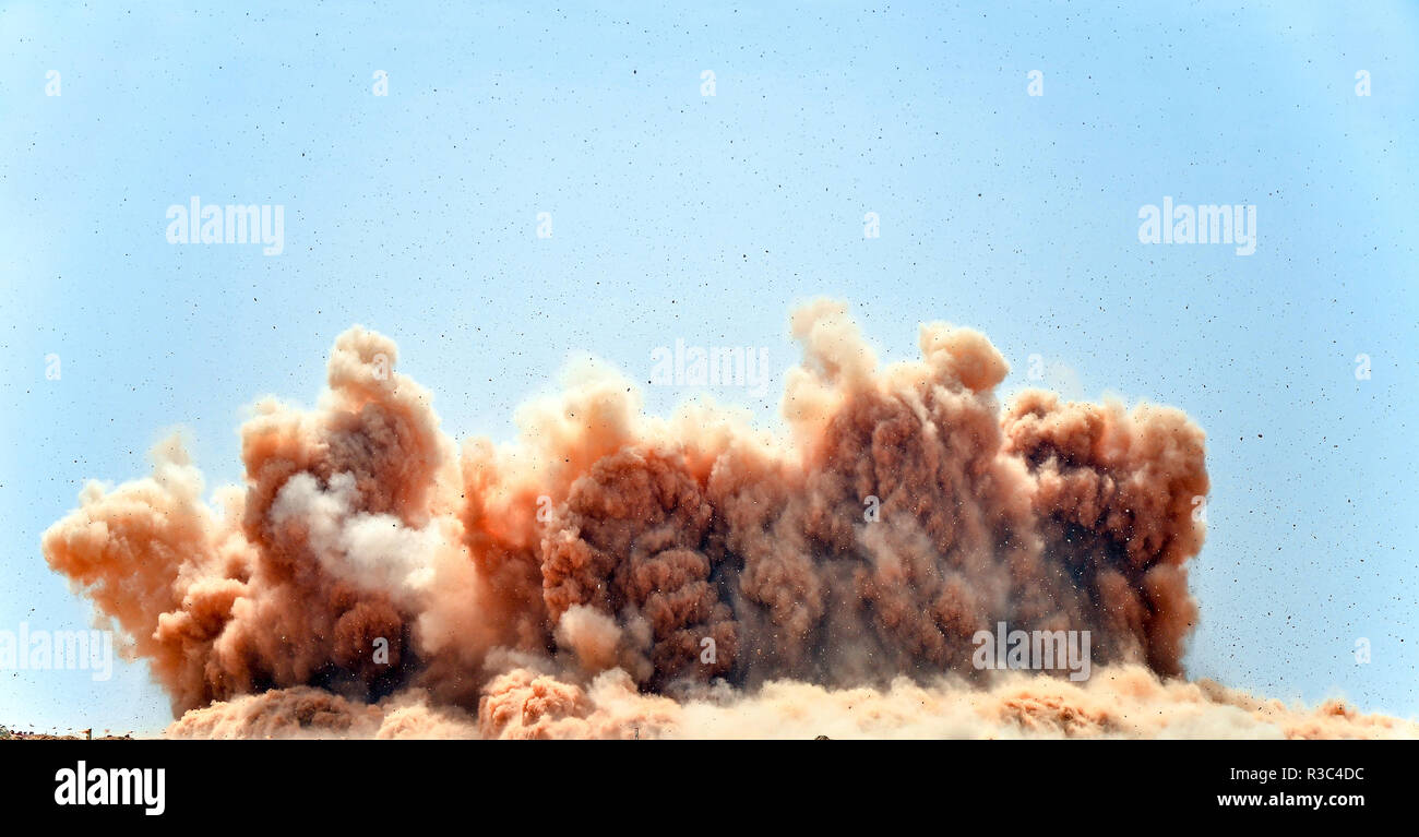 Blasting dust clouds on the mining site Stock Photo - Alamy