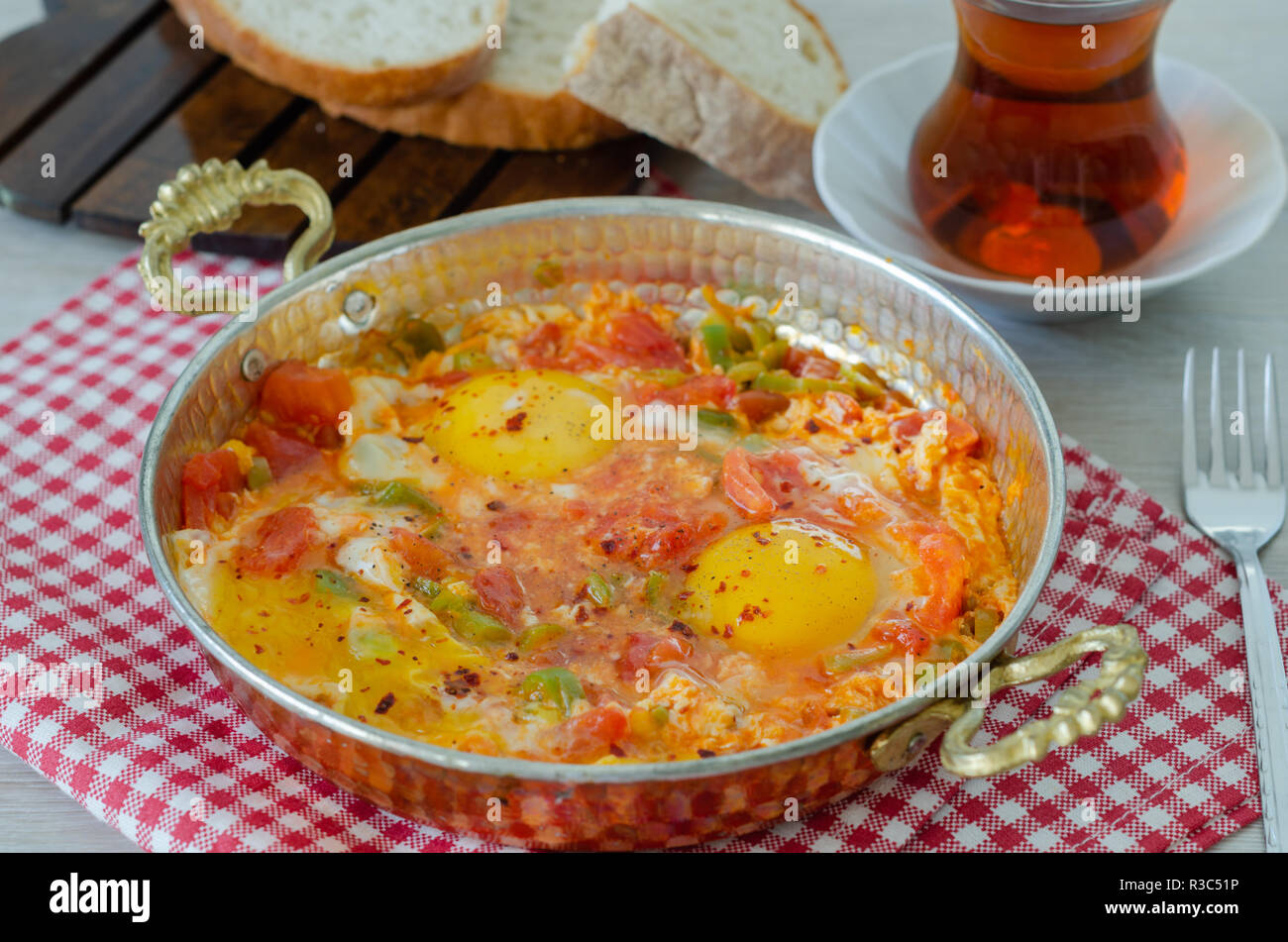 Traditional turkish food menemen made by eggs, pepper and tomatoes ...
