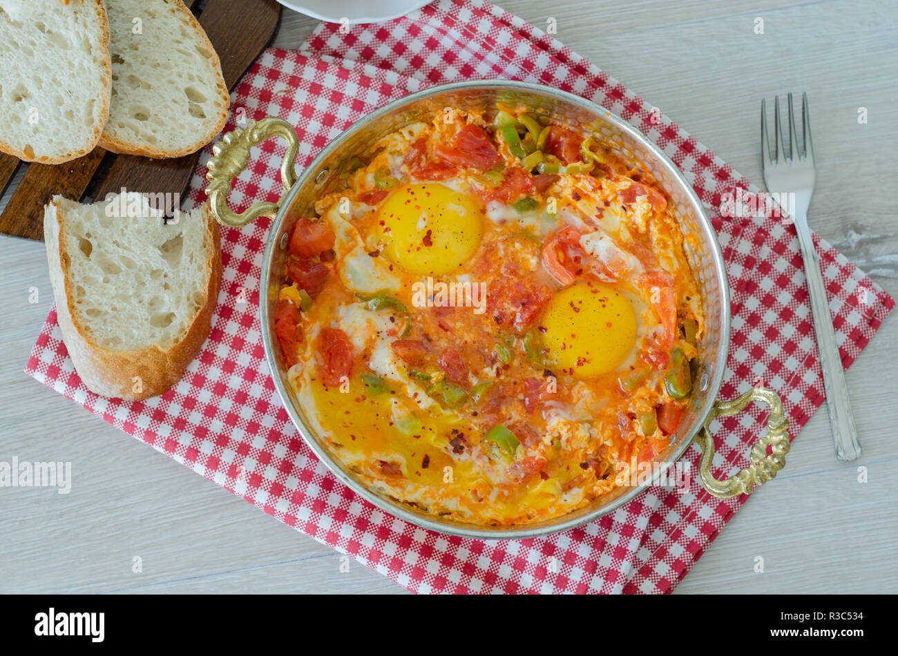 Traditional turkish food menemen made by eggs, pepper and tomatoes ...
