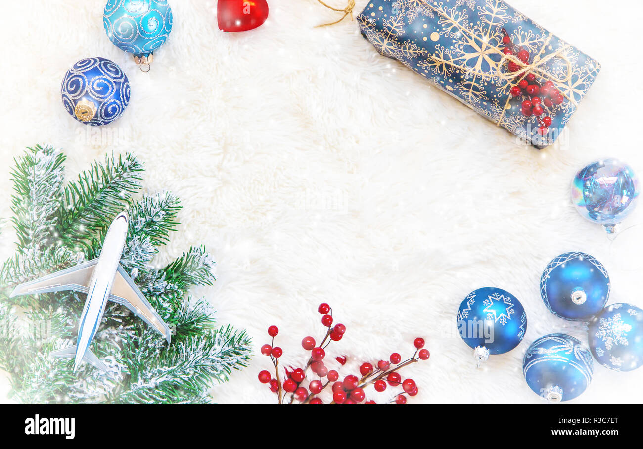 Christmas background on the theme of travel. The plane symbolizes the ...