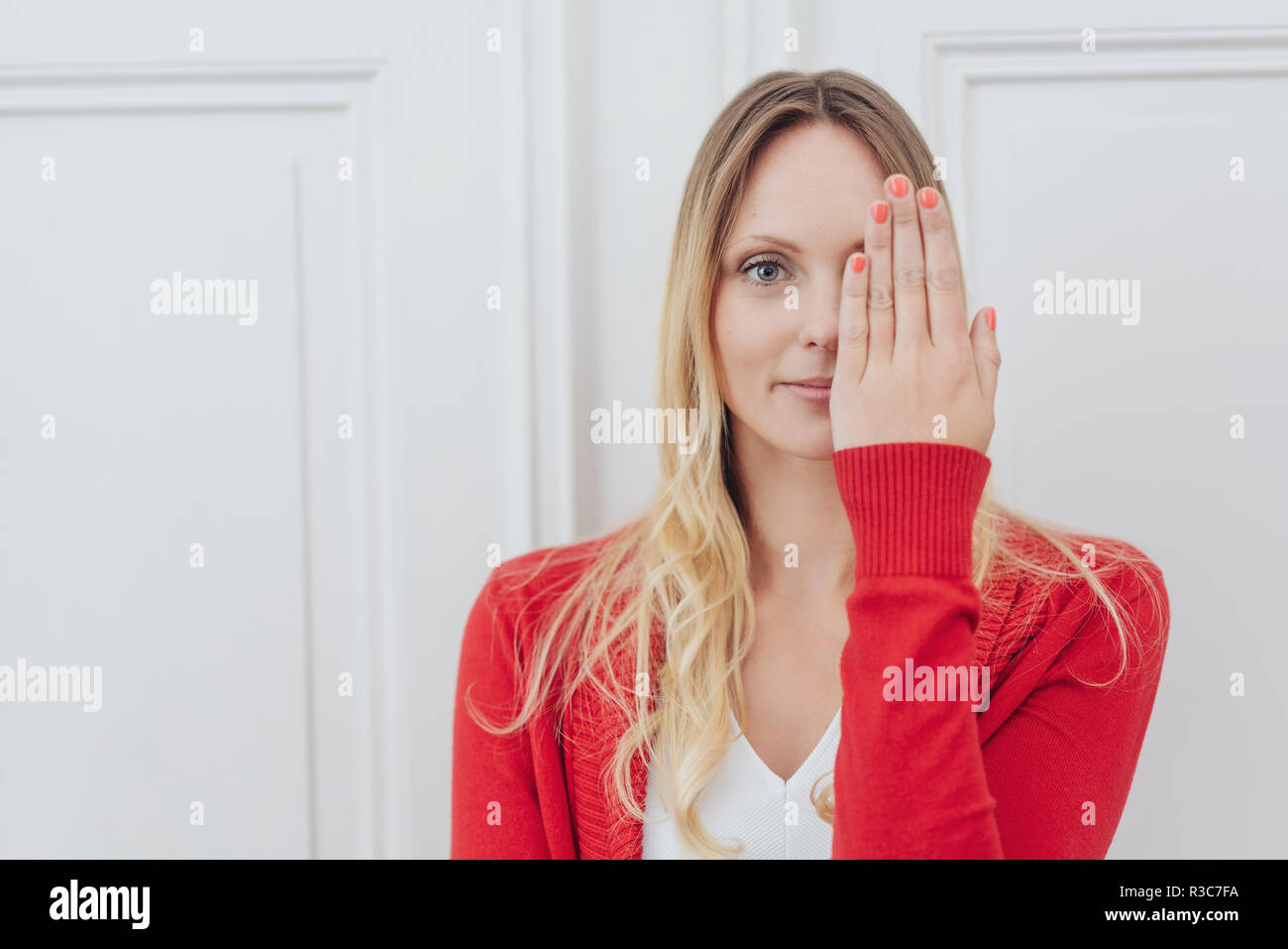 Woman covering half face hand hi-res stock photography and images - Alamy