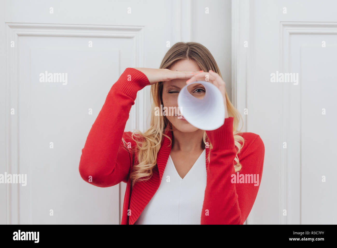 Woman looking through paper roll hi-res stock photography and images ...