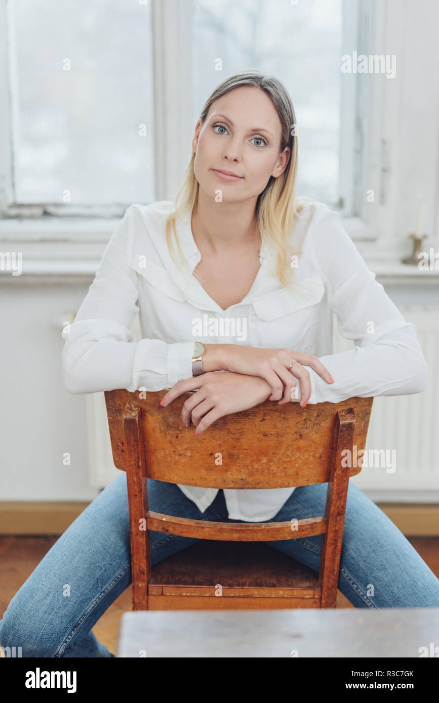 Woman leaning back in chair hi-res stock photography and images - Alamy