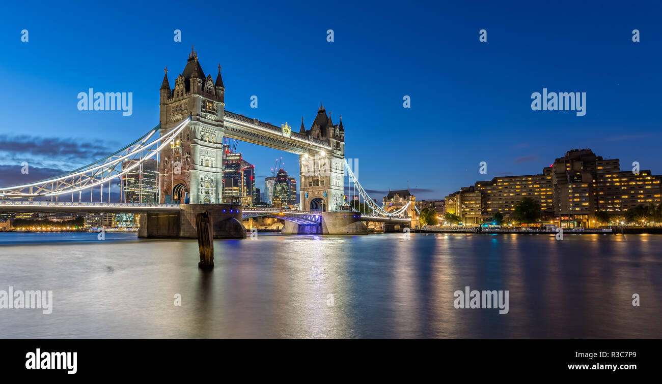 The Tower Bridge in London lights up in the Evening Stock Photo - Alamy