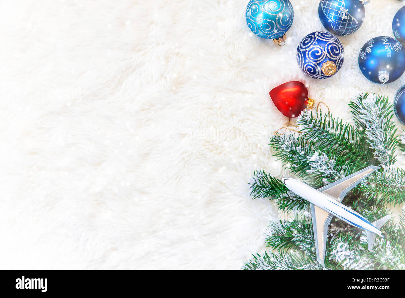 Christmas background on the theme of travel. The plane symbolizes the ...