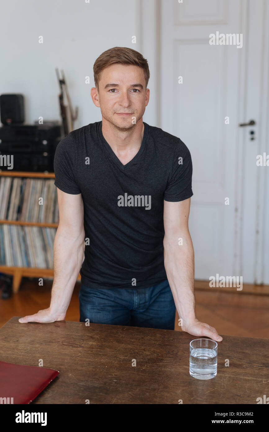 Man standing over desk hi-res stock photography and images - Alamy