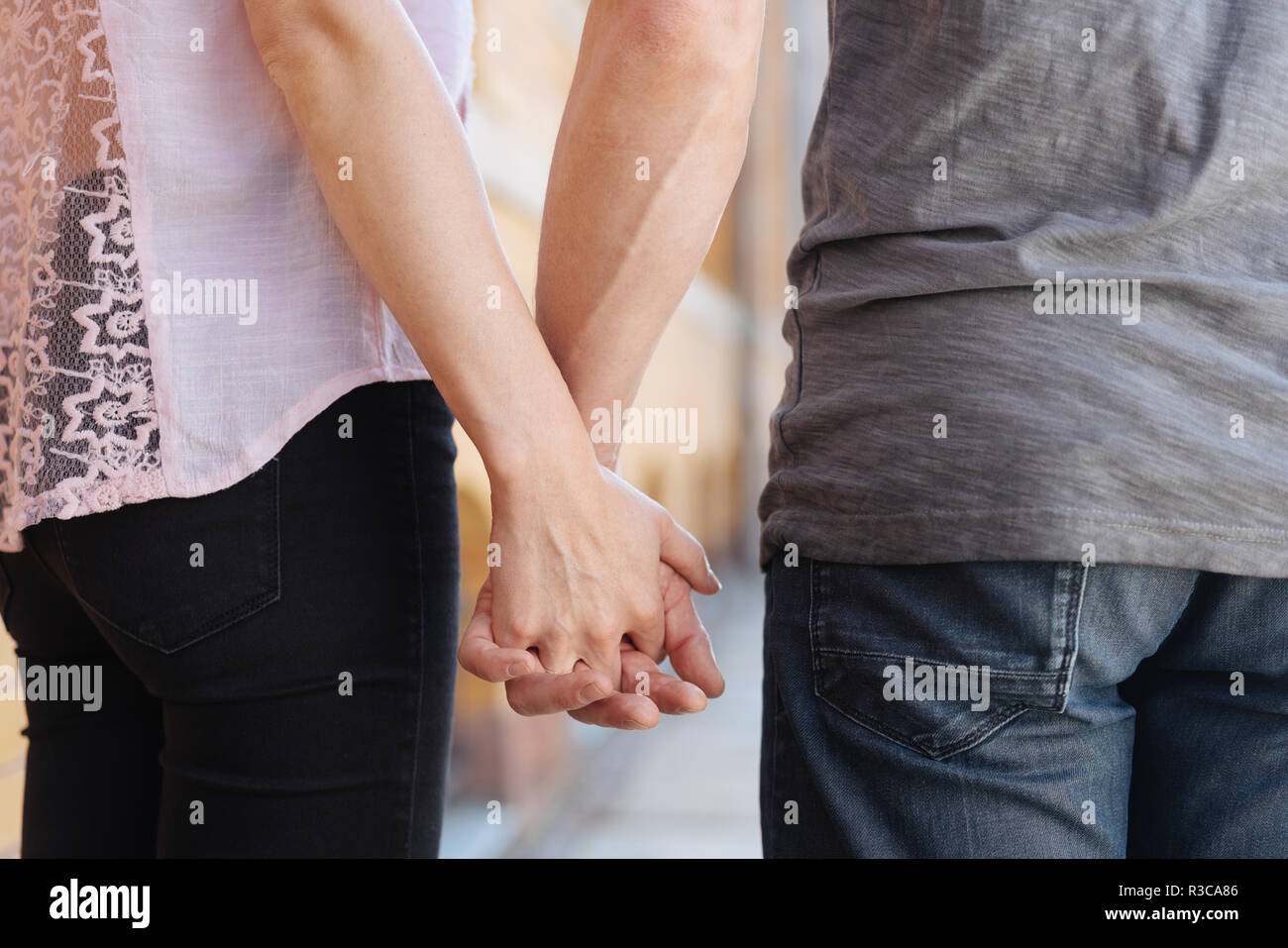 Hands clasped couple close hi-res stock photography and images - Alamy