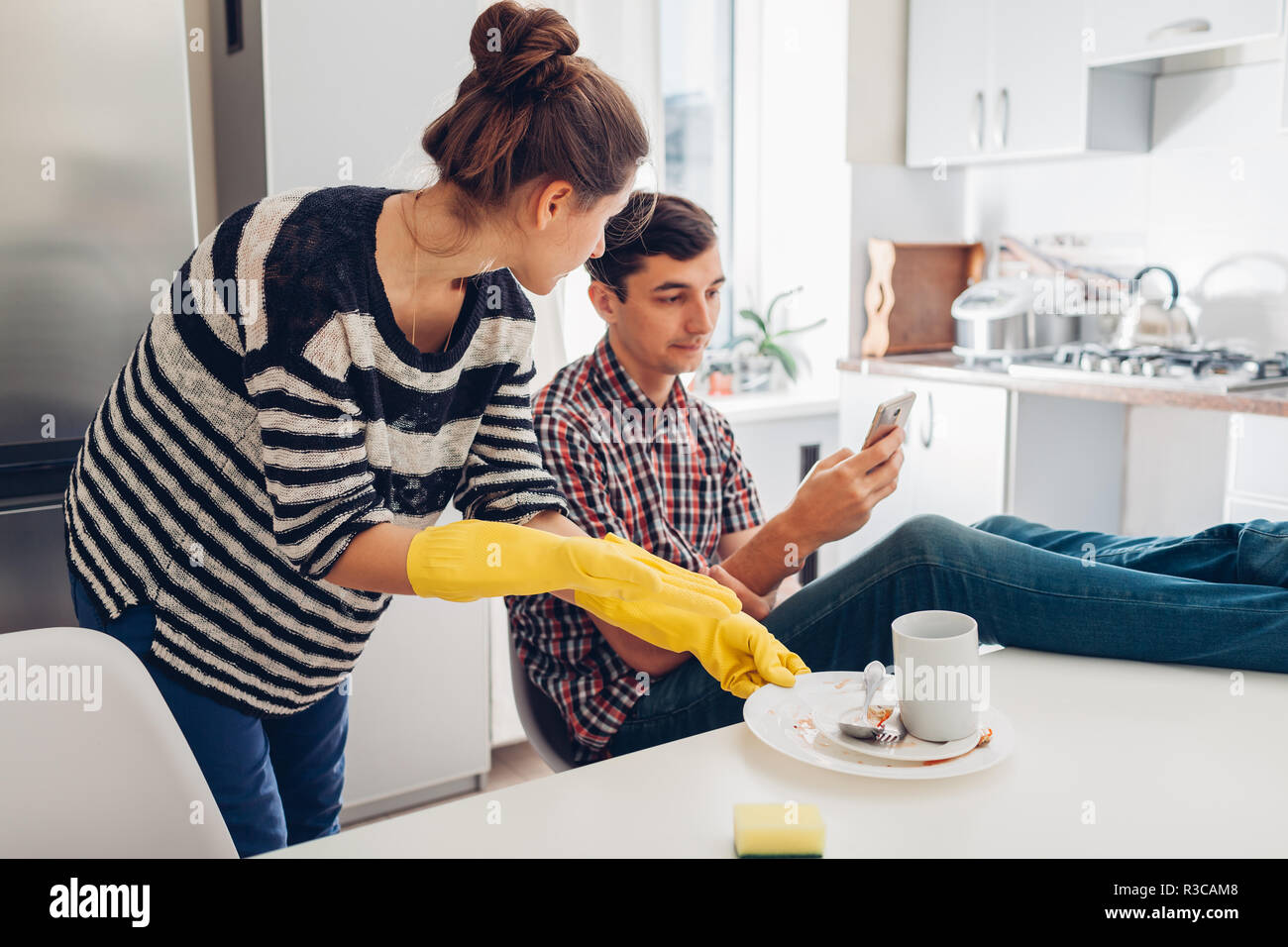 Woman housework lazy man hi-res stock photography and images - Alamy
