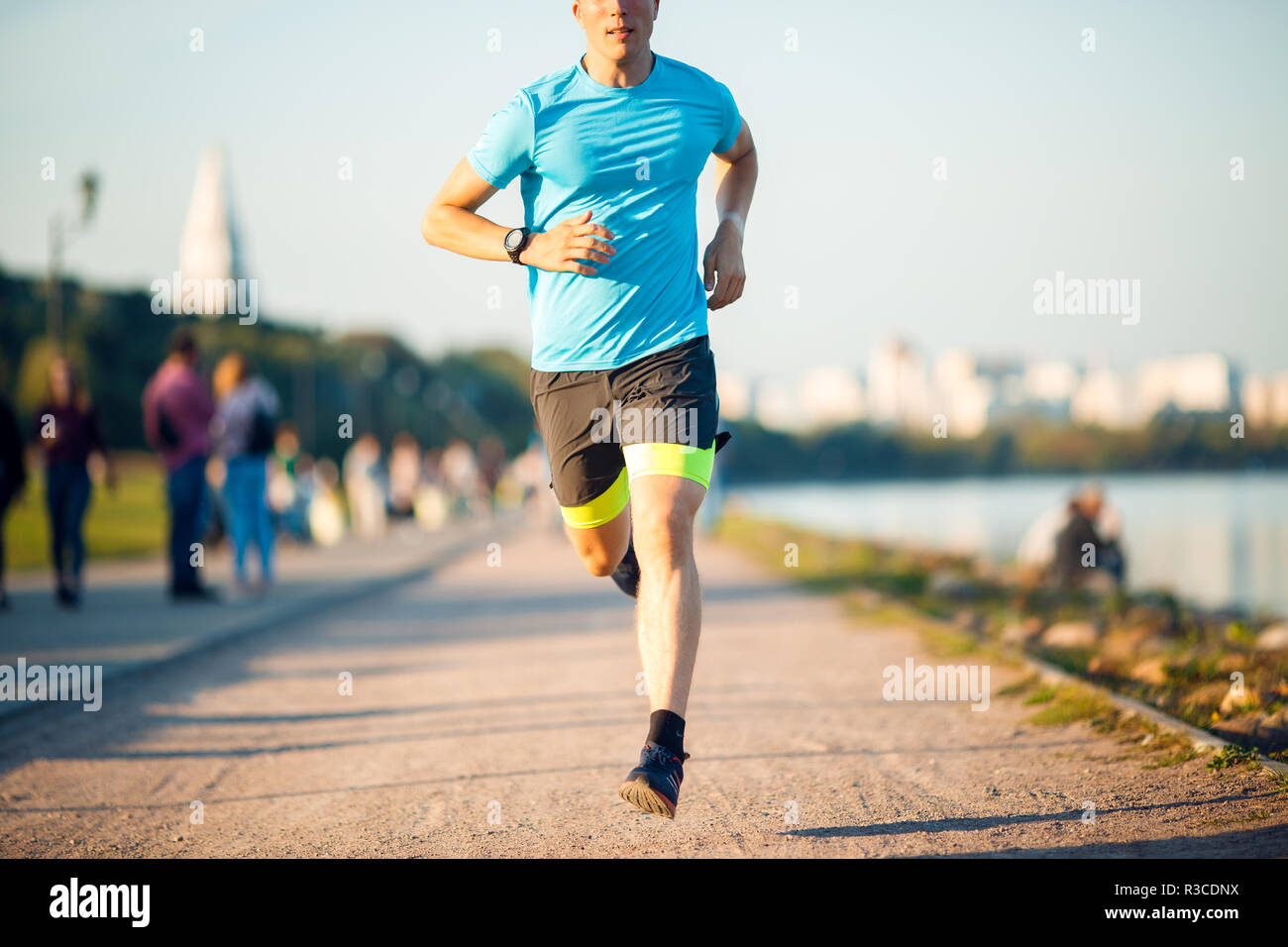 Photo of running sportsman at promenade on summer morning Stock Photo ...
