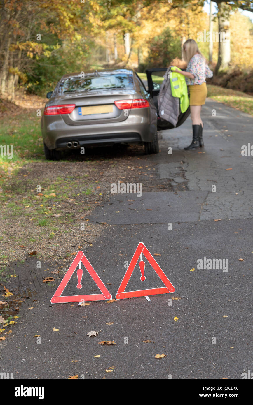 Red warning reflective triangles on the roadside Stock Photo - Alamy