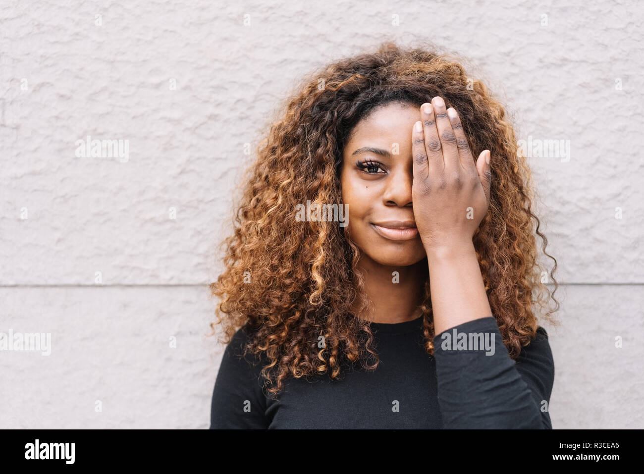 One eye covered with hair hi-res stock photography and images - Alamy