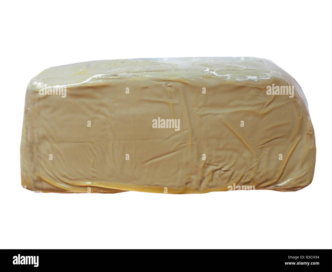Putty adhesive isolated over white Stock Photo - Alamy