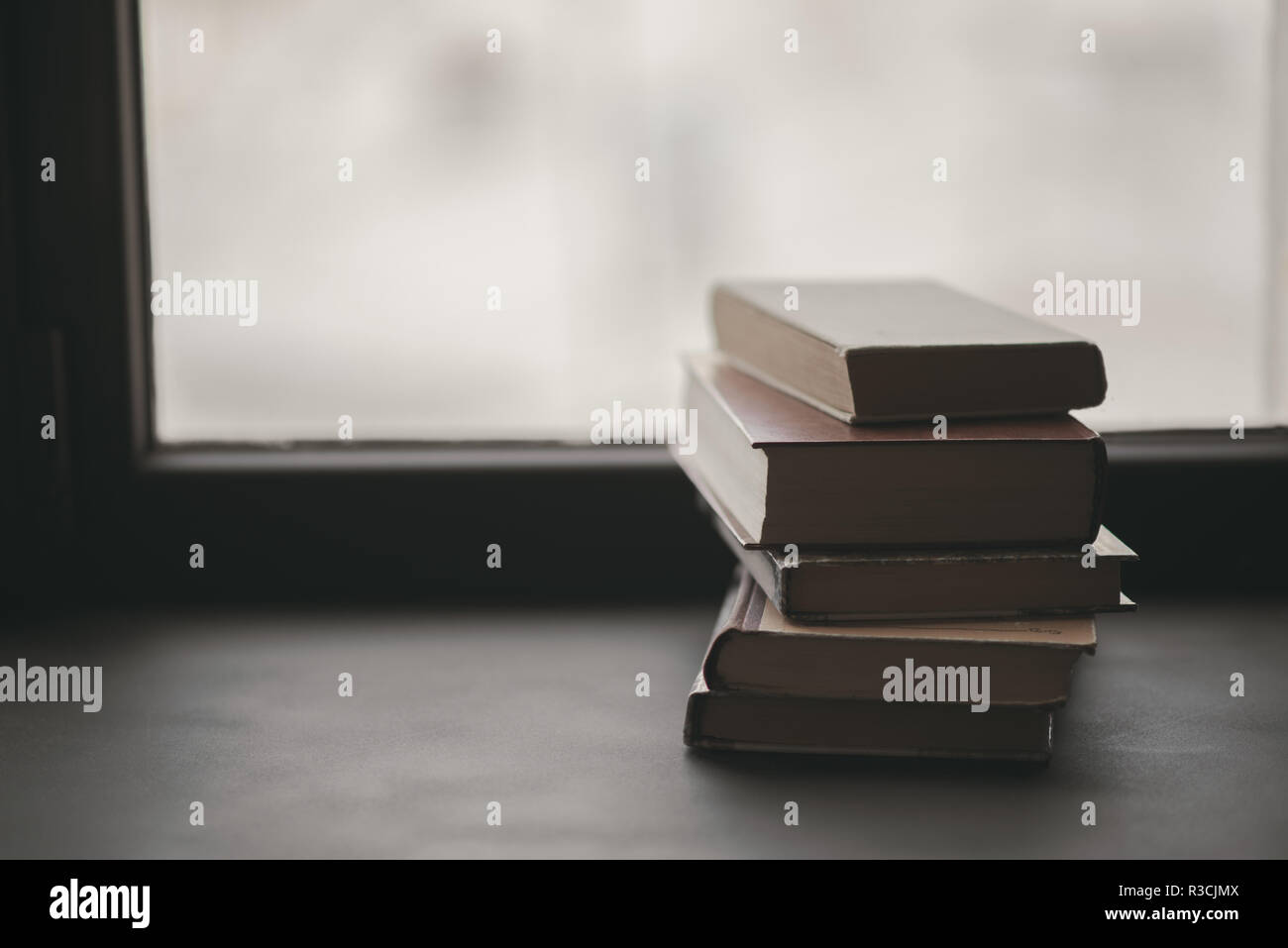 Books on the window Stock Photo - Alamy