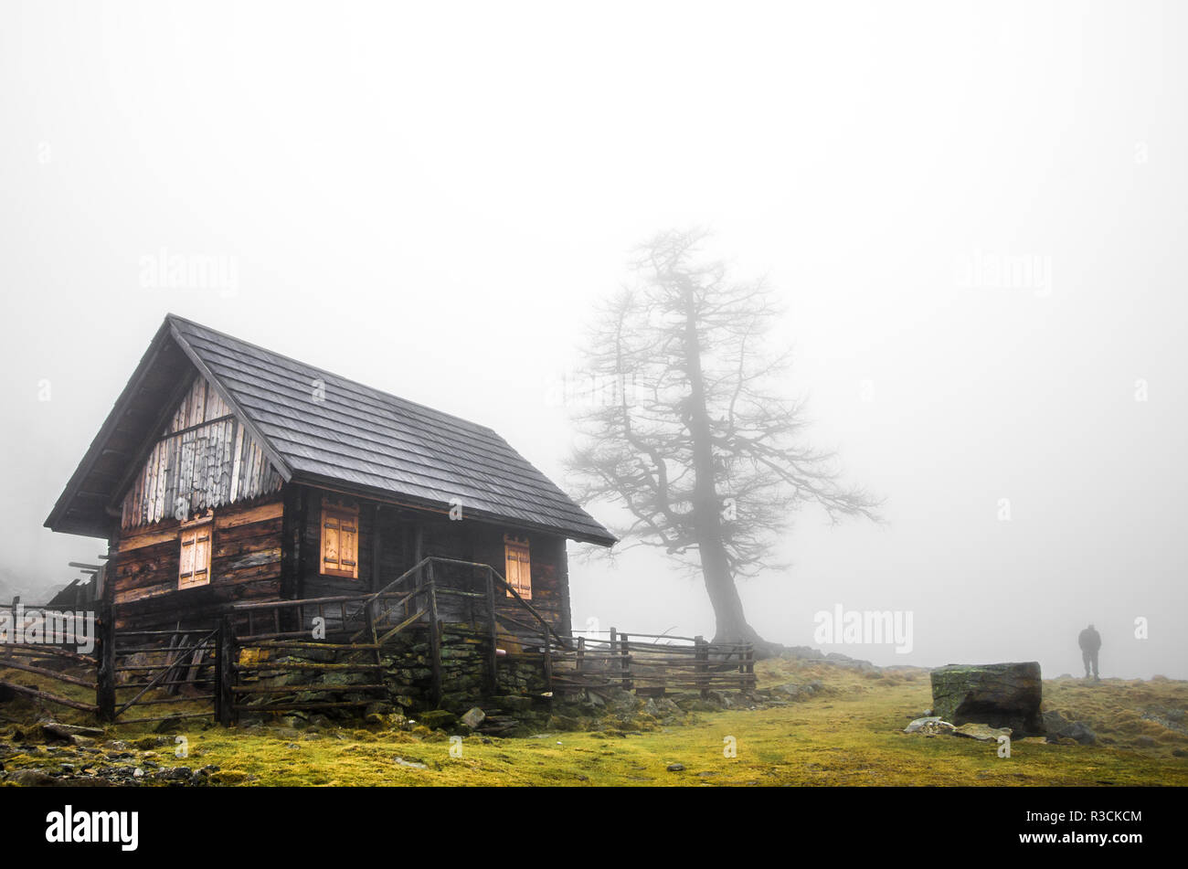 alpine hut in the fog Stock Photo - Alamy
