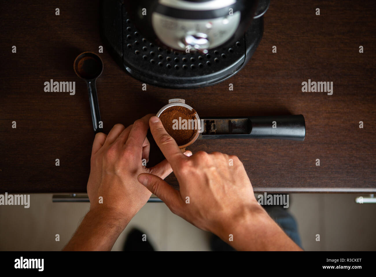 Image of coffee maker, human hand pouring coffee Stock Photo - Alamy