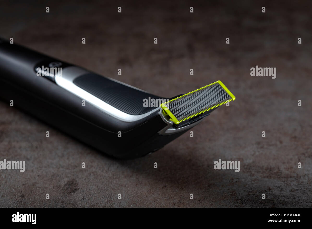 Electrical shaver on a dark background Stock Photo - Alamy