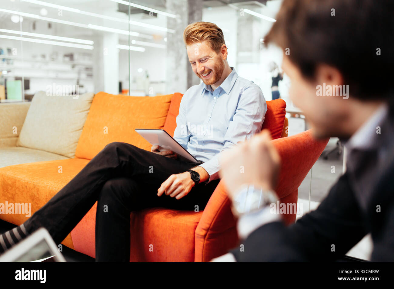 Business people looking at their devices Stock Photo - Alamy