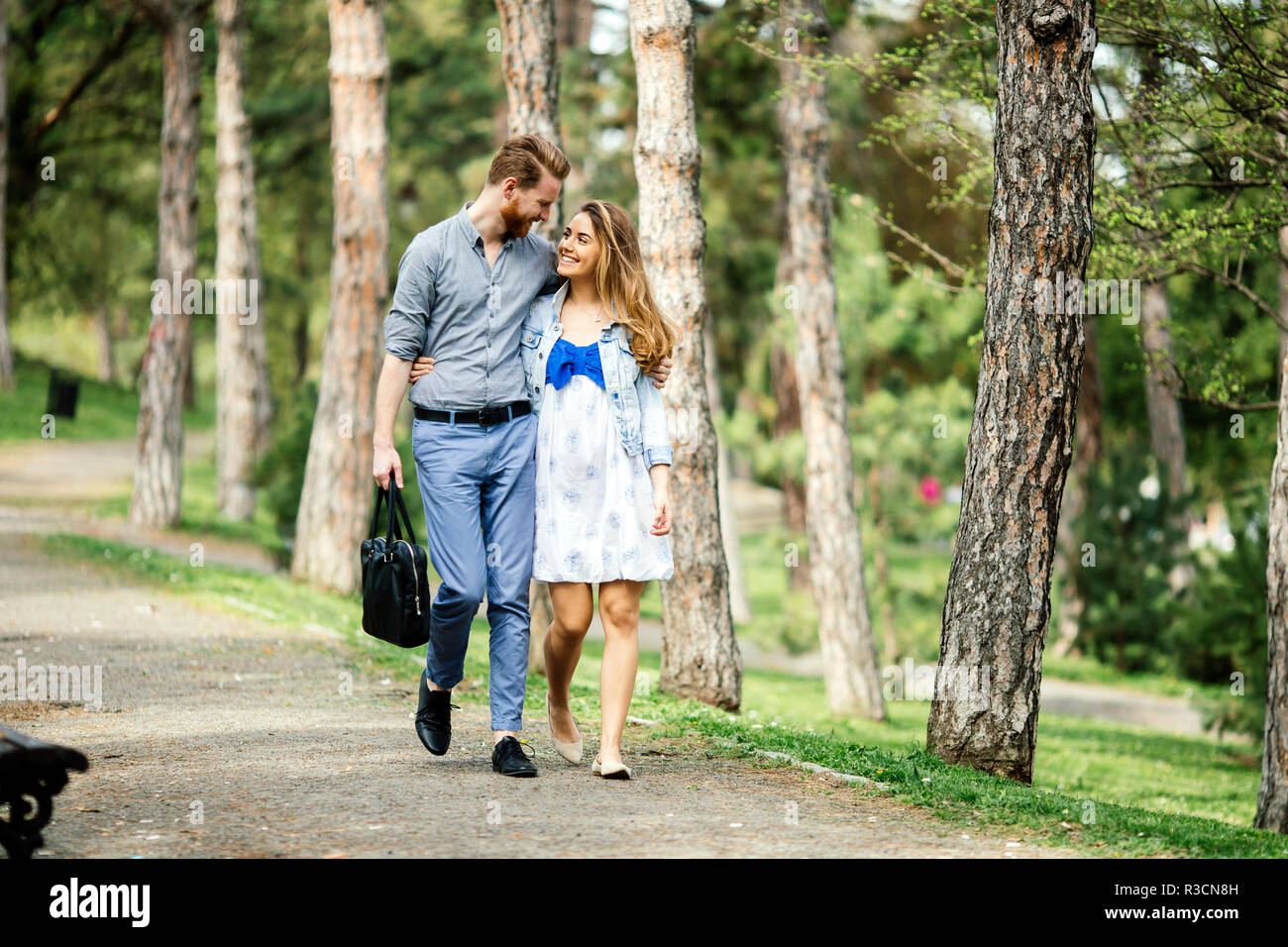 Beautiful couple taking a walk in nature Stock Photo - Alamy