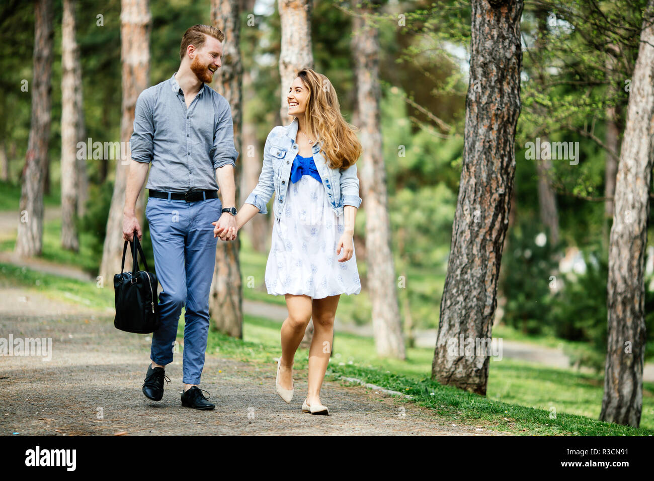 Beautiful couple bonding in park Stock Photo - Alamy
