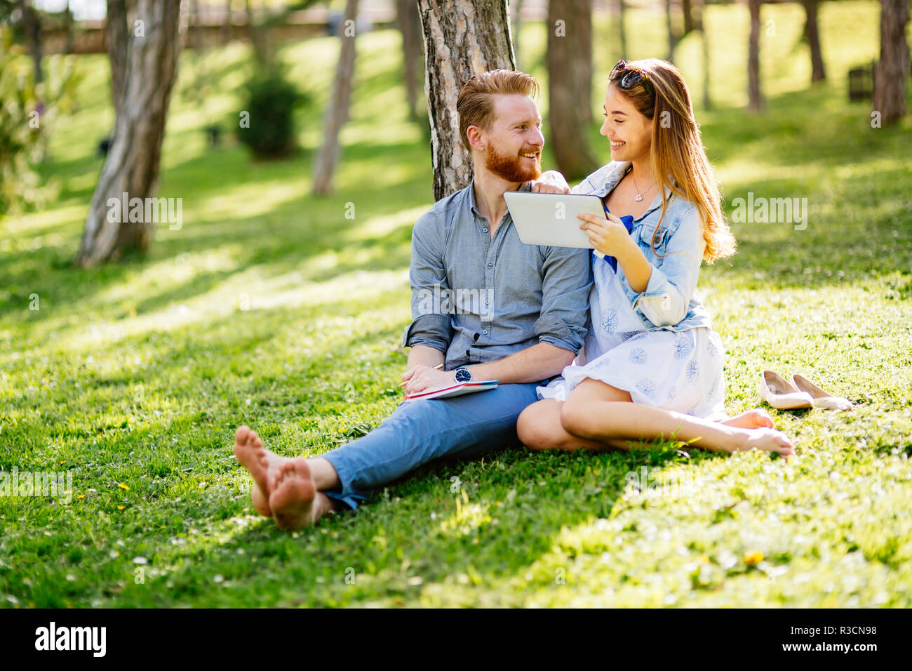 Cute uni students studying together Stock Photo - Alamy
