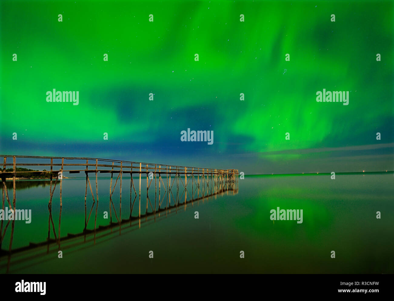 Canada, Manitoba, Matlock. Northern lights reflected in Lake Winnipeg ...