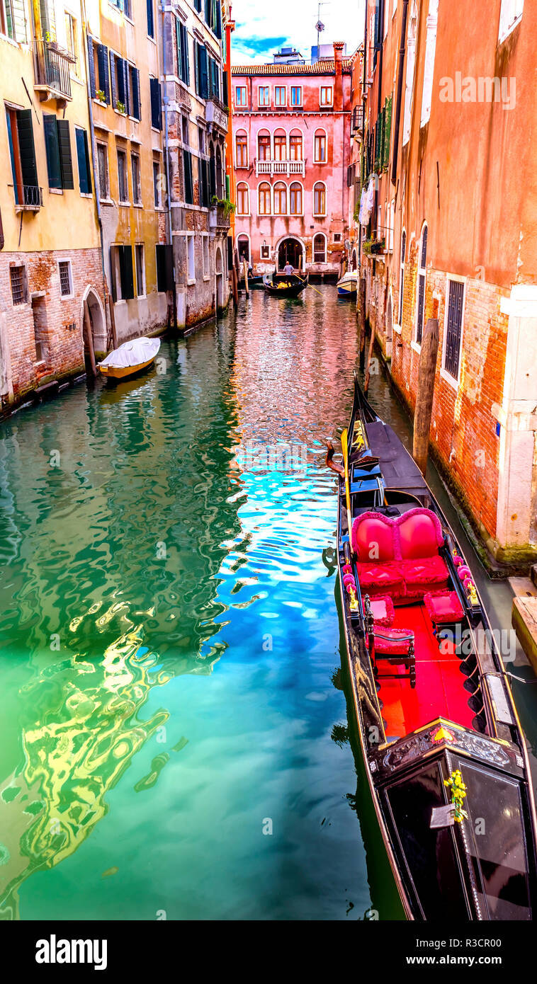 Small canal bridge, red fancy gondola, Venice, Italy Stock Photo - Alamy