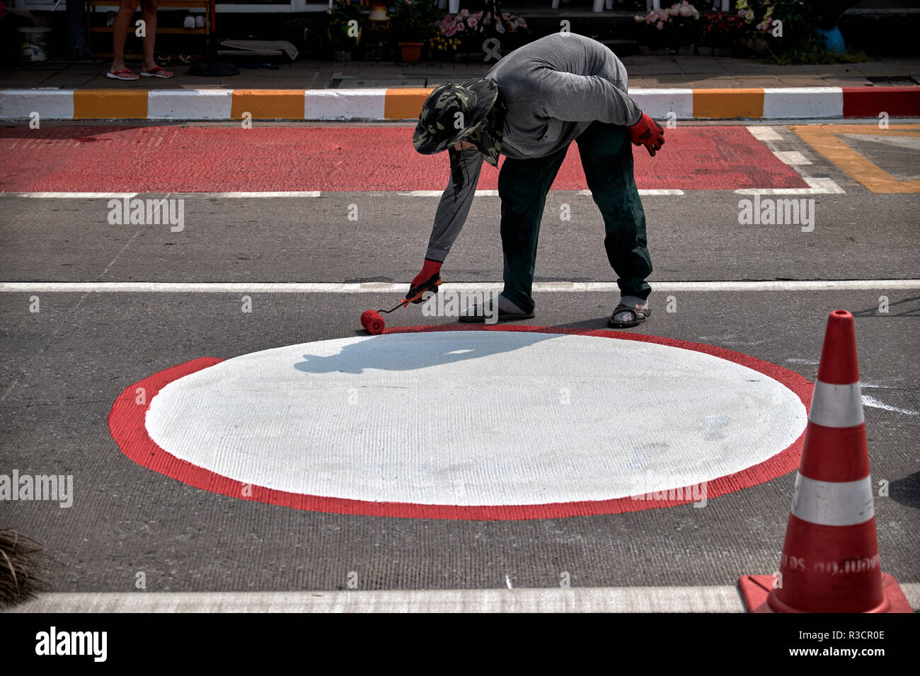 Road marking and speed sign warning painted by hand. Thailand Southeast ...