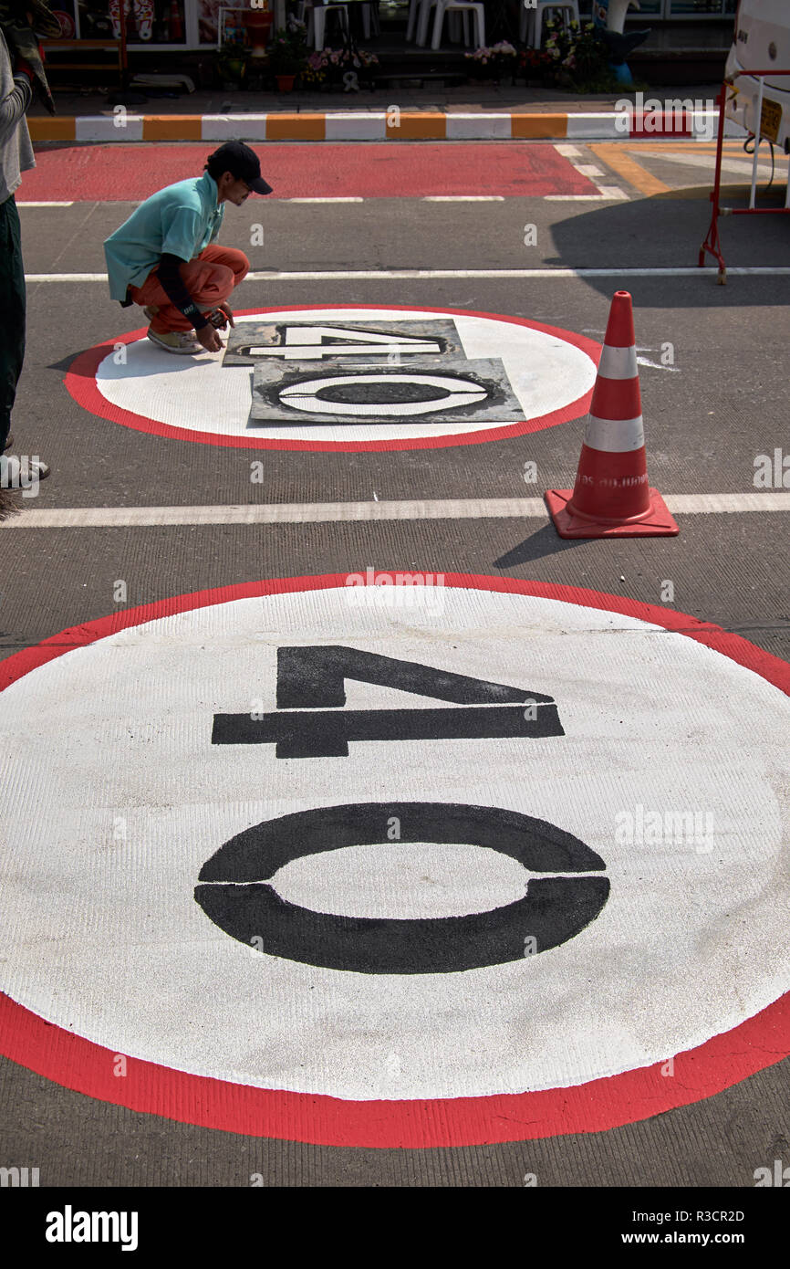 Road marking and speed sign warning painted by hand. Thailand Southeast ...