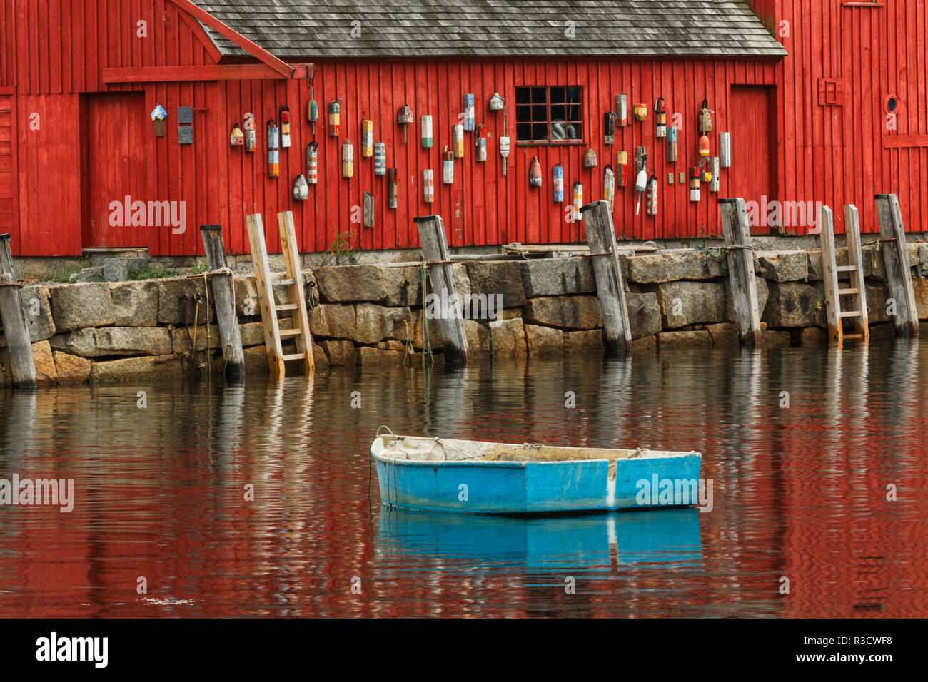 Blue boat and famous Motif Number 1 with buoys on red wall, Rockport ...
