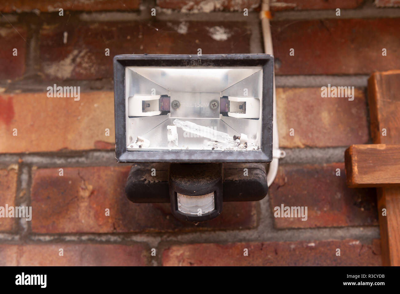 Failed linear halogen tungsten light floodlight bulb that has exploded ...