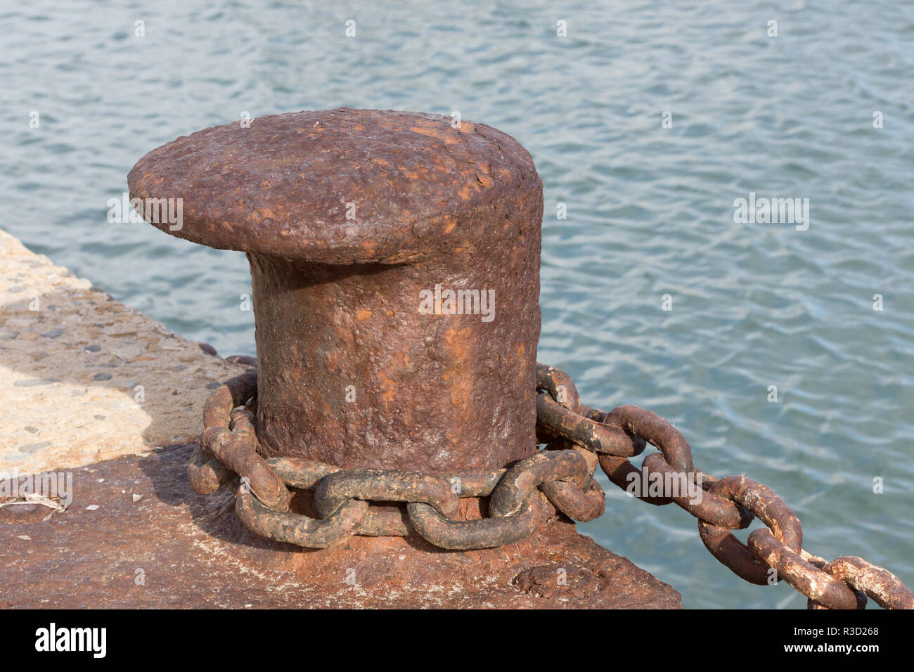 rusty bollard in harbor Stock Photo - Alamy